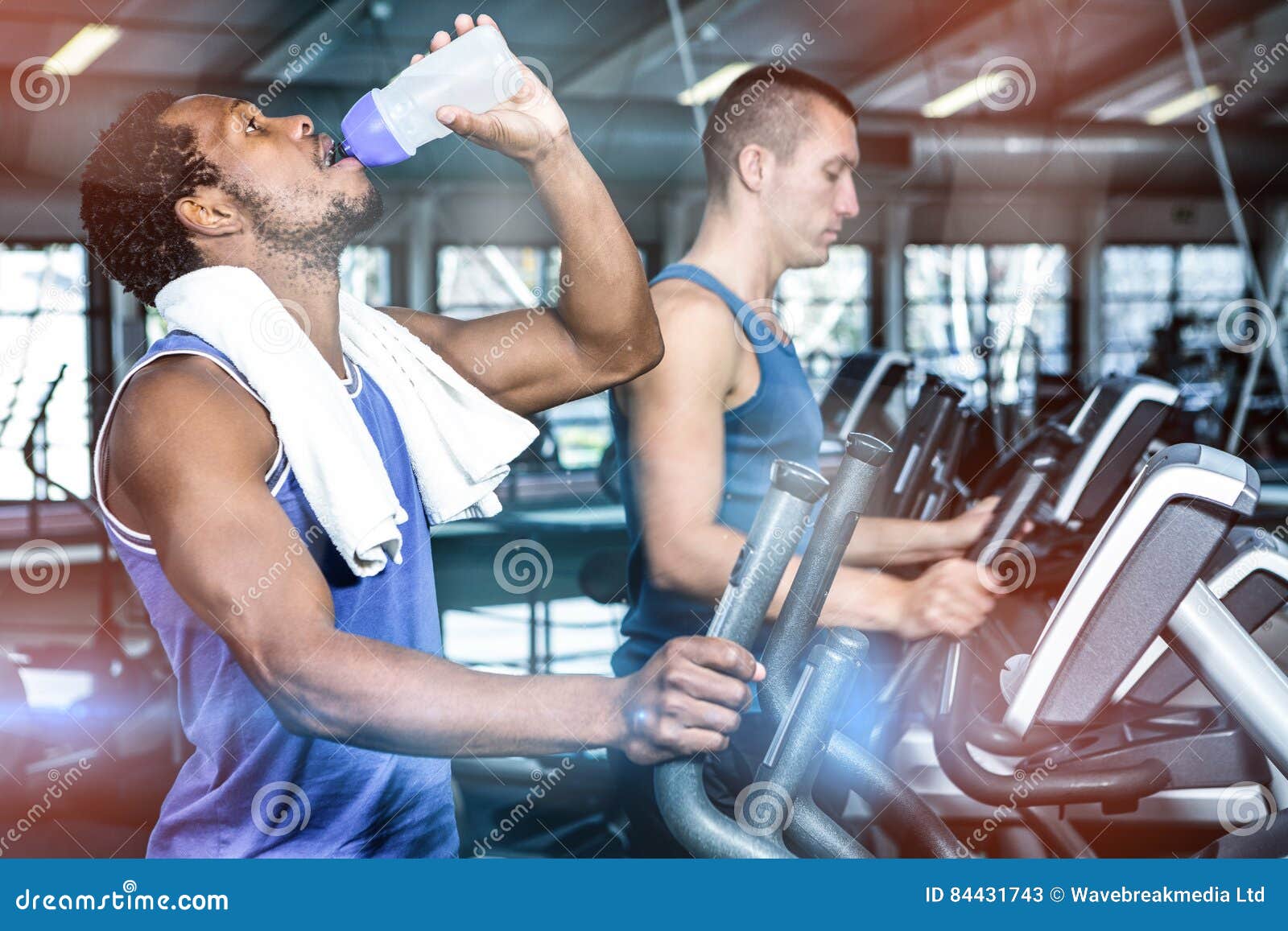 Man Drinking Water Using Elliptical Machine Stock Photos - Free ...