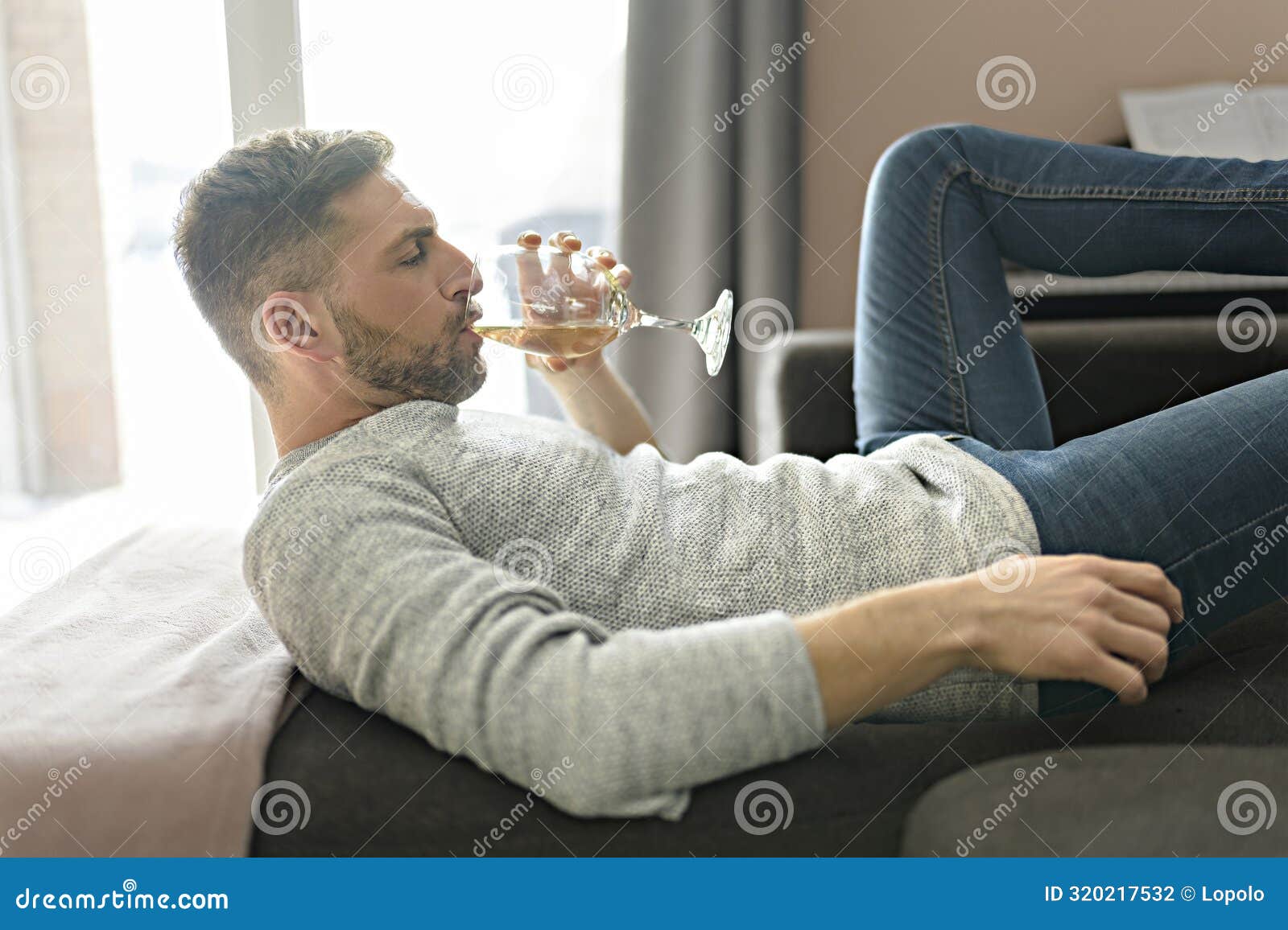 Man Drinking Wine while Having Fun Lay on Sofa Stock Photo - Image of ...