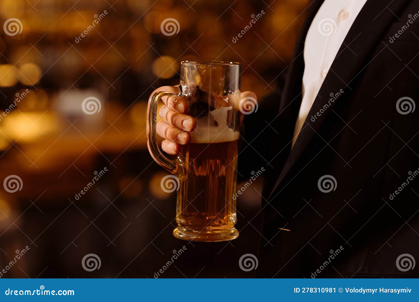 A Man Drinks Beer. Side View of Handsome Bald Man Drinking Beer in ...