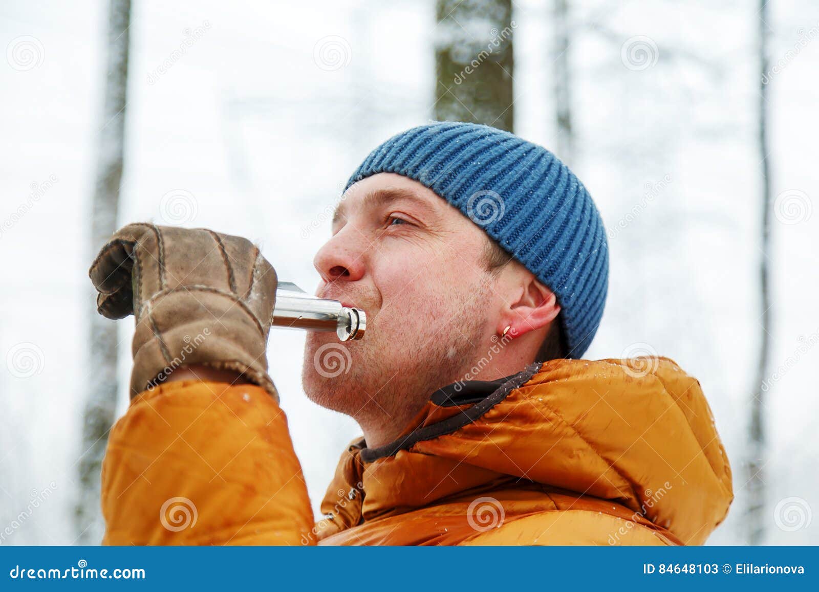 Man drinks from a flask. stock image. Image of relationship - 84648103