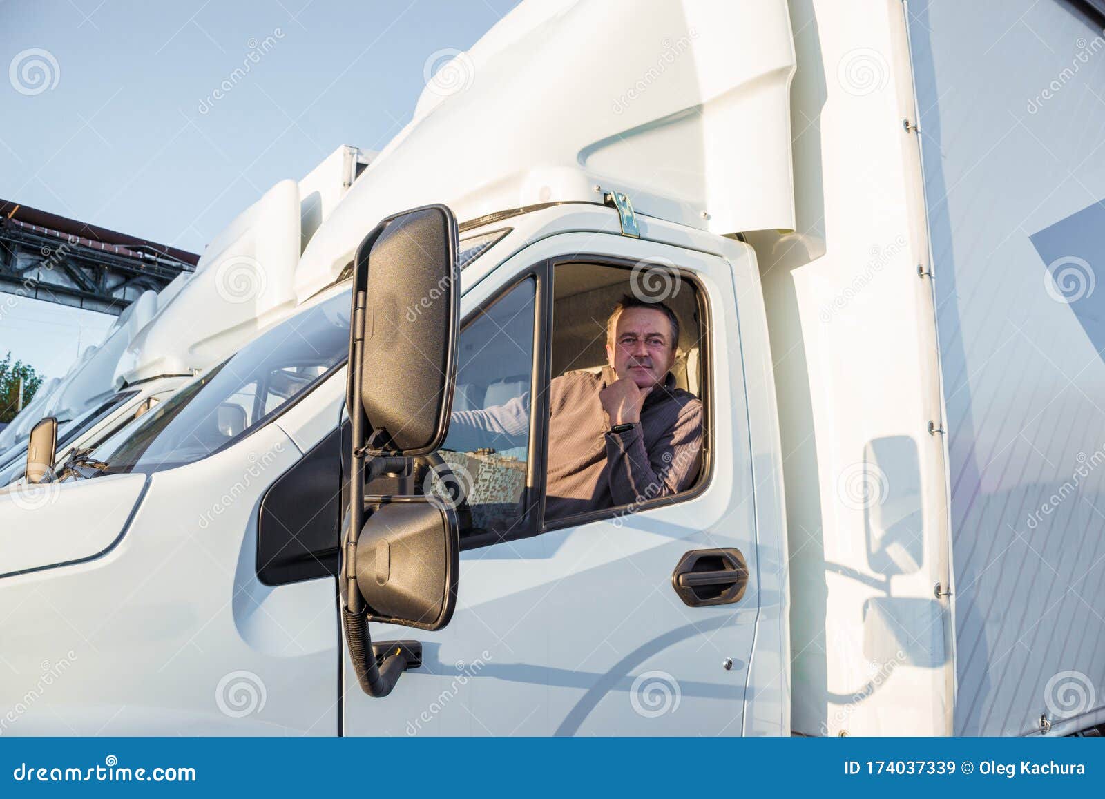 A Man Driver is Sitting in the Cab of a Modern Truck Stock Image ...