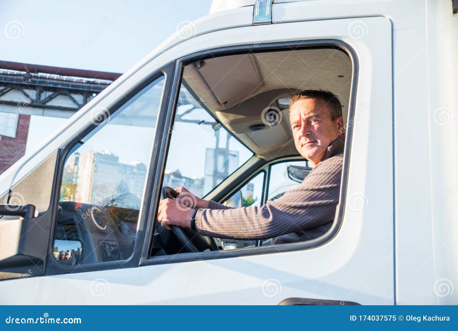 A Man Driver is Sitting in the Cab of a Modern Truck Stock Image ...