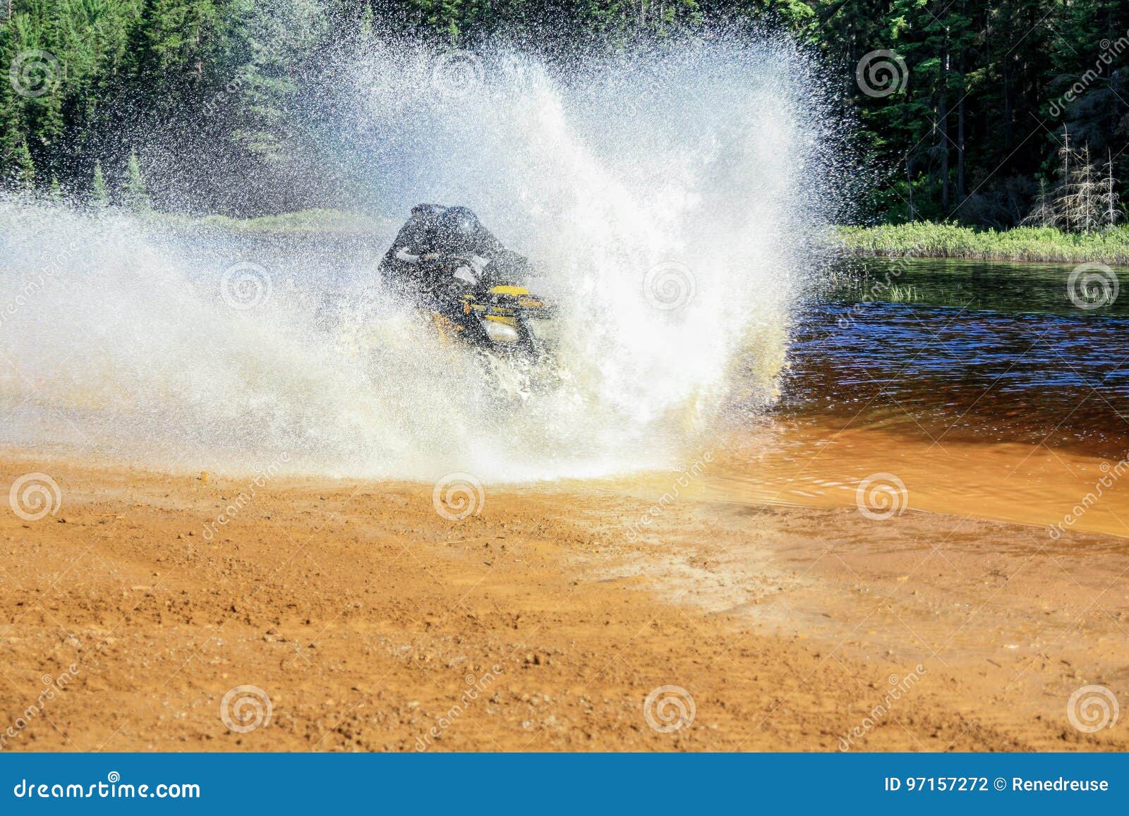 Man Driving ATV Quad through Splashing Water with High Speed. Stock ...