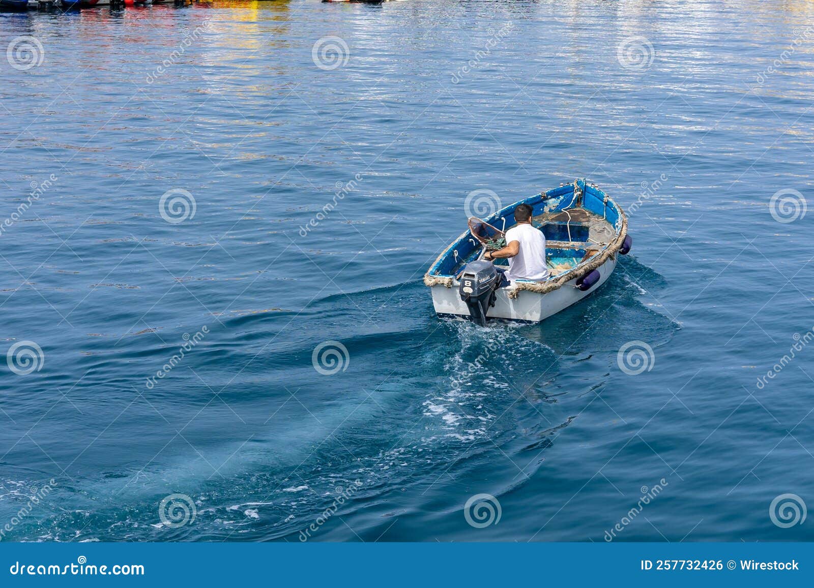 Man Driving a Boat in the Sea Stock Photo - Image of boat, driving ...