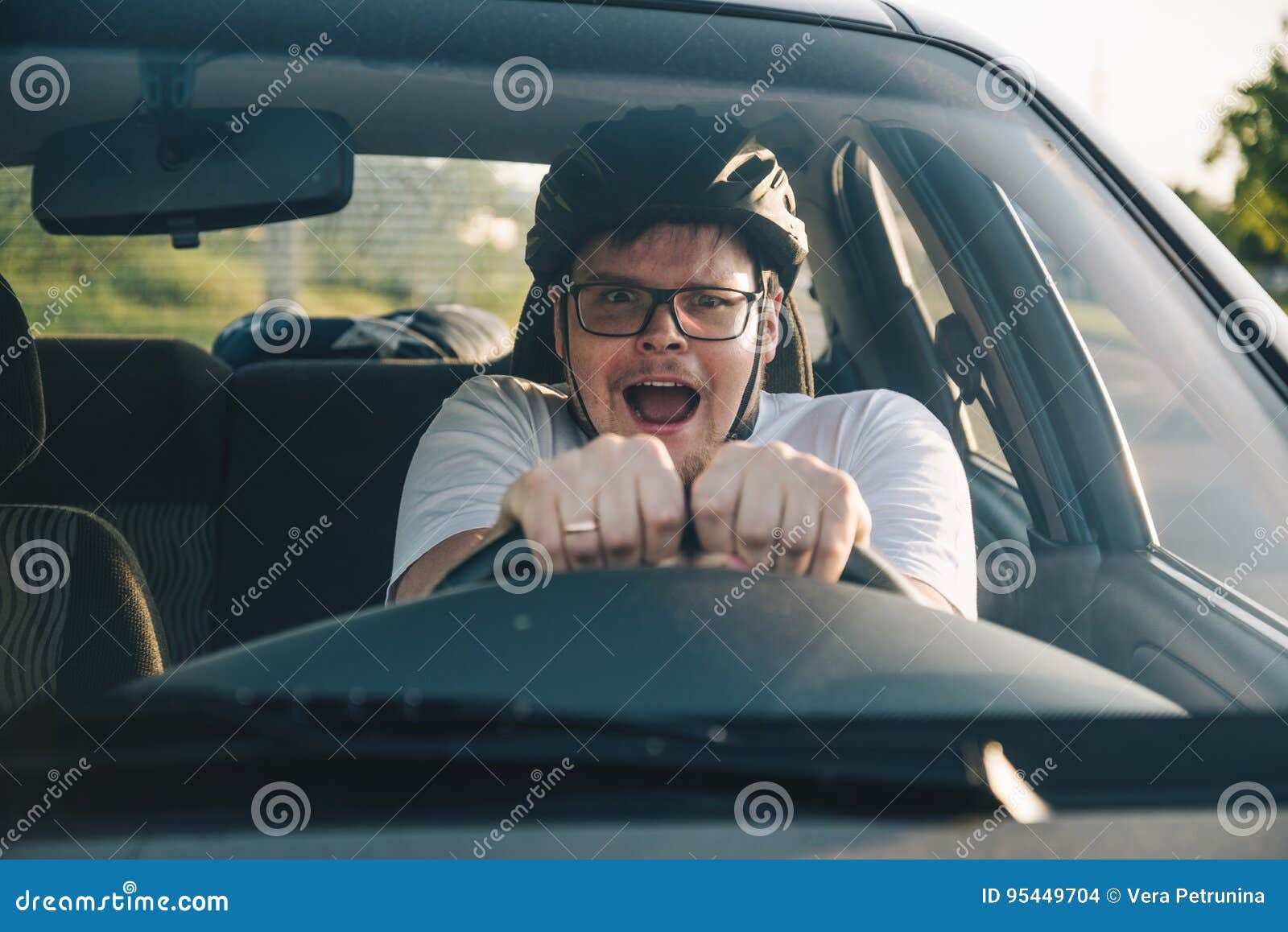 Man Driving Car in Helmet with Horror on Her Face Stock Photo - Image ...