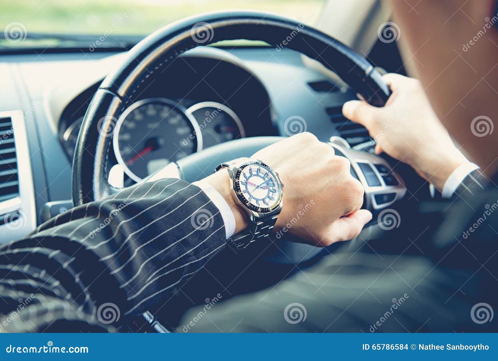 Man Driving a Car and Looking at Watch Stock Photo - Image of leasing ...
