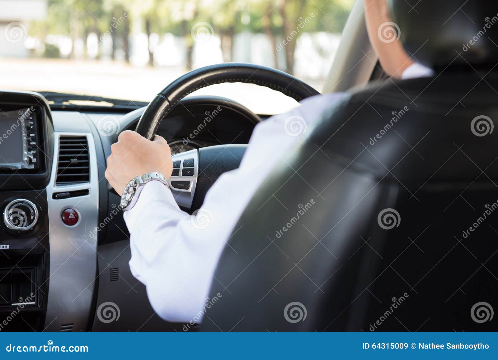 Man Driving a Car and Looking at Watch Stock Image - Image of control ...