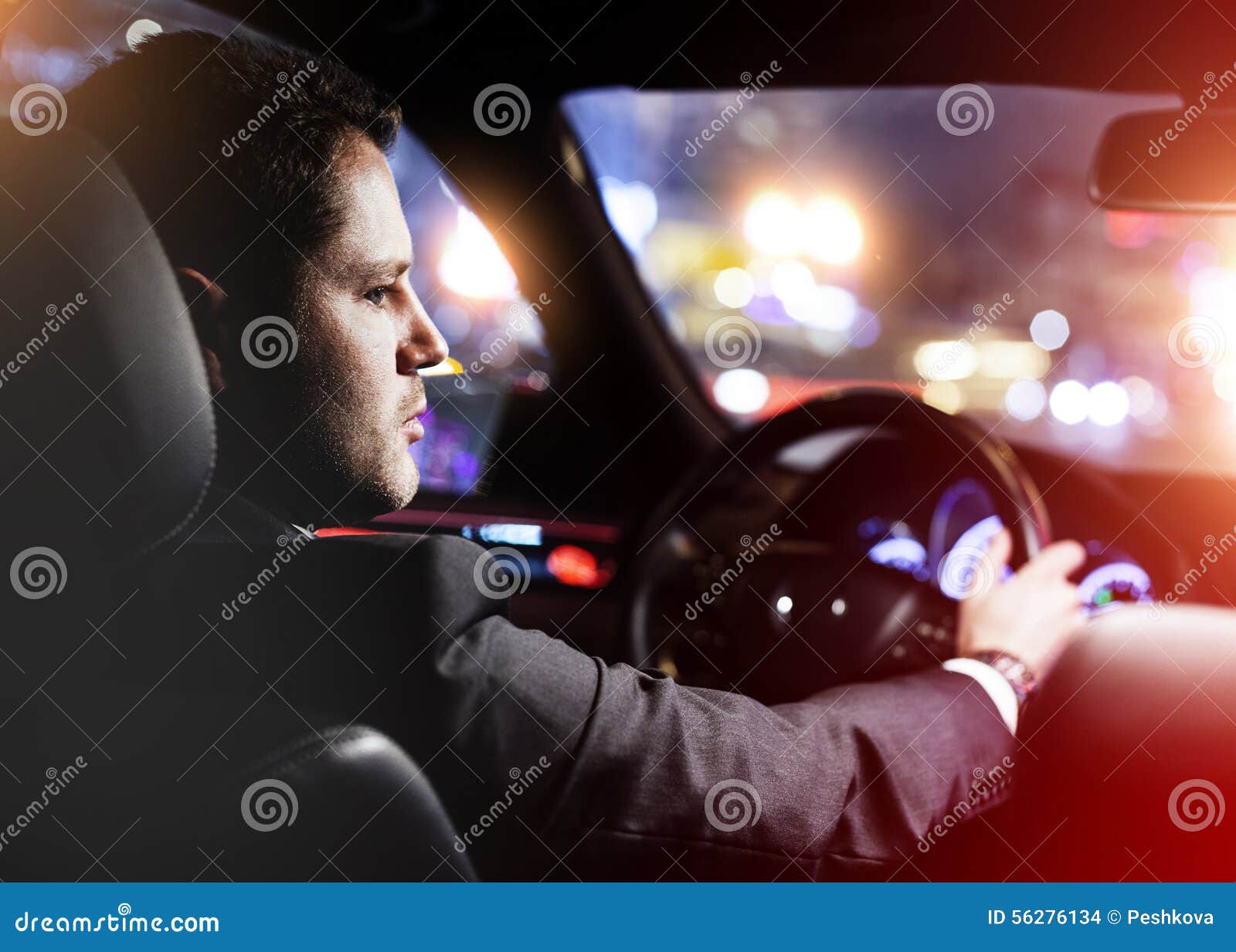Man driving a car at night stock photo. Image of radio - 56276134