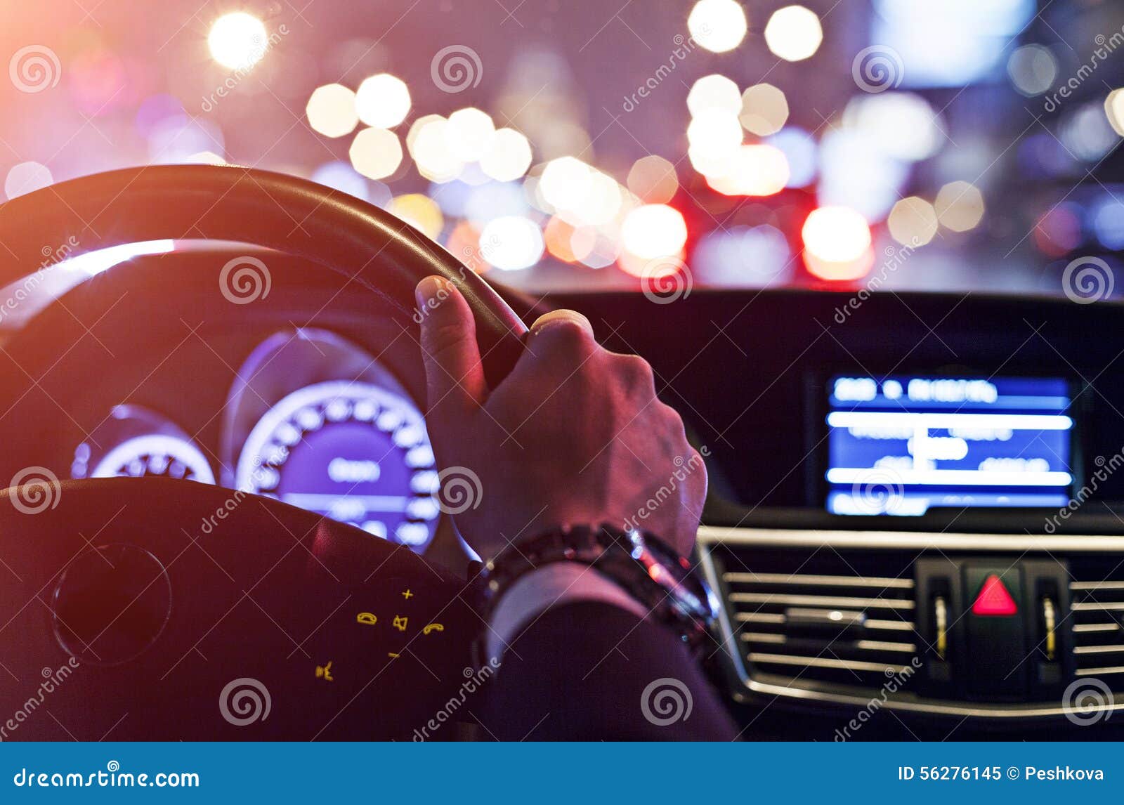 Man driving a car at night stock image. Image of road - 56276145