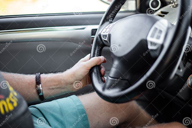 A Man is Driving a Car. Side View from Inside the Car Stock Image ...