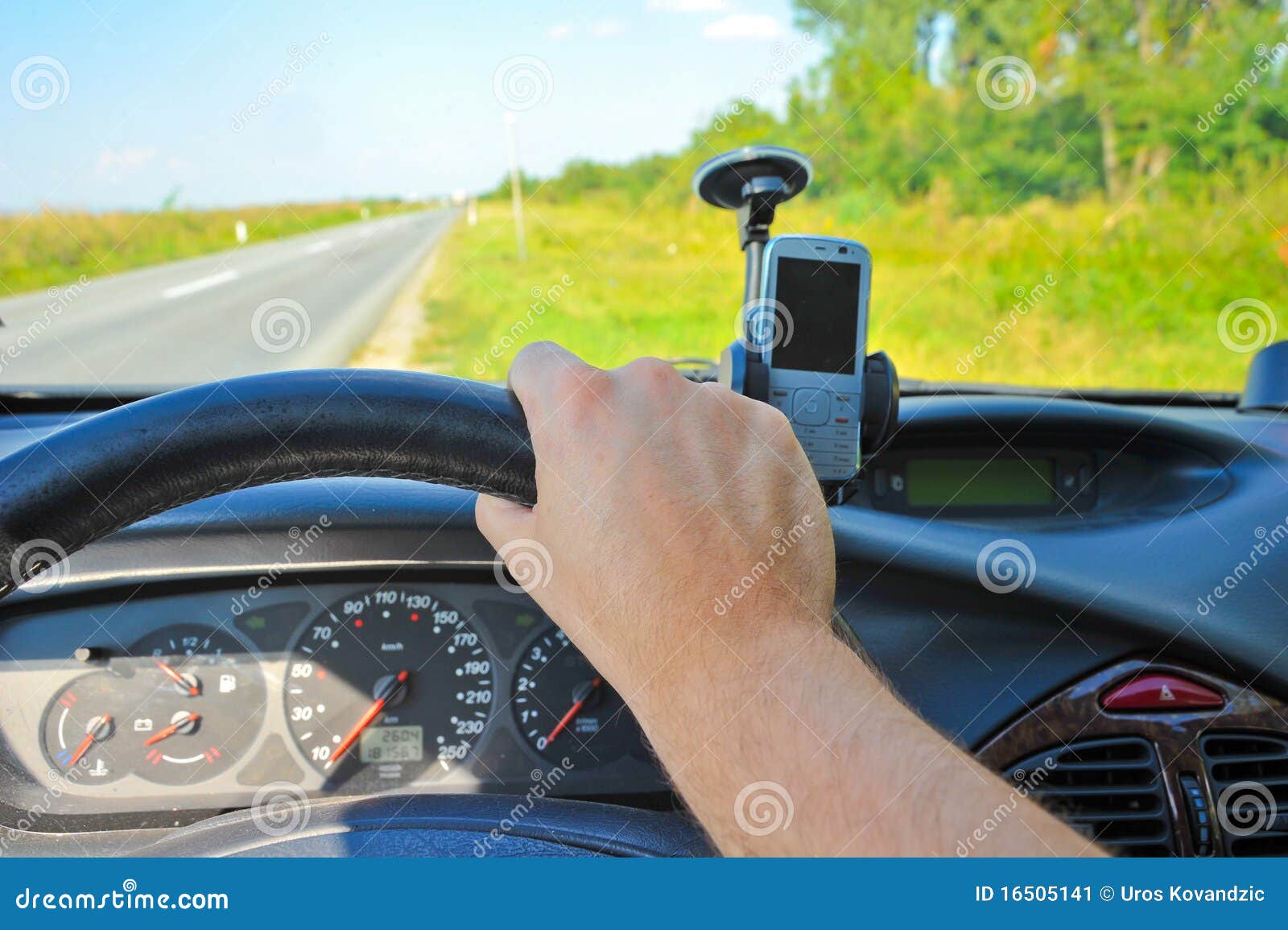 Man Driving a Car with Telephone on a Windshield Stock Image - Image of ...