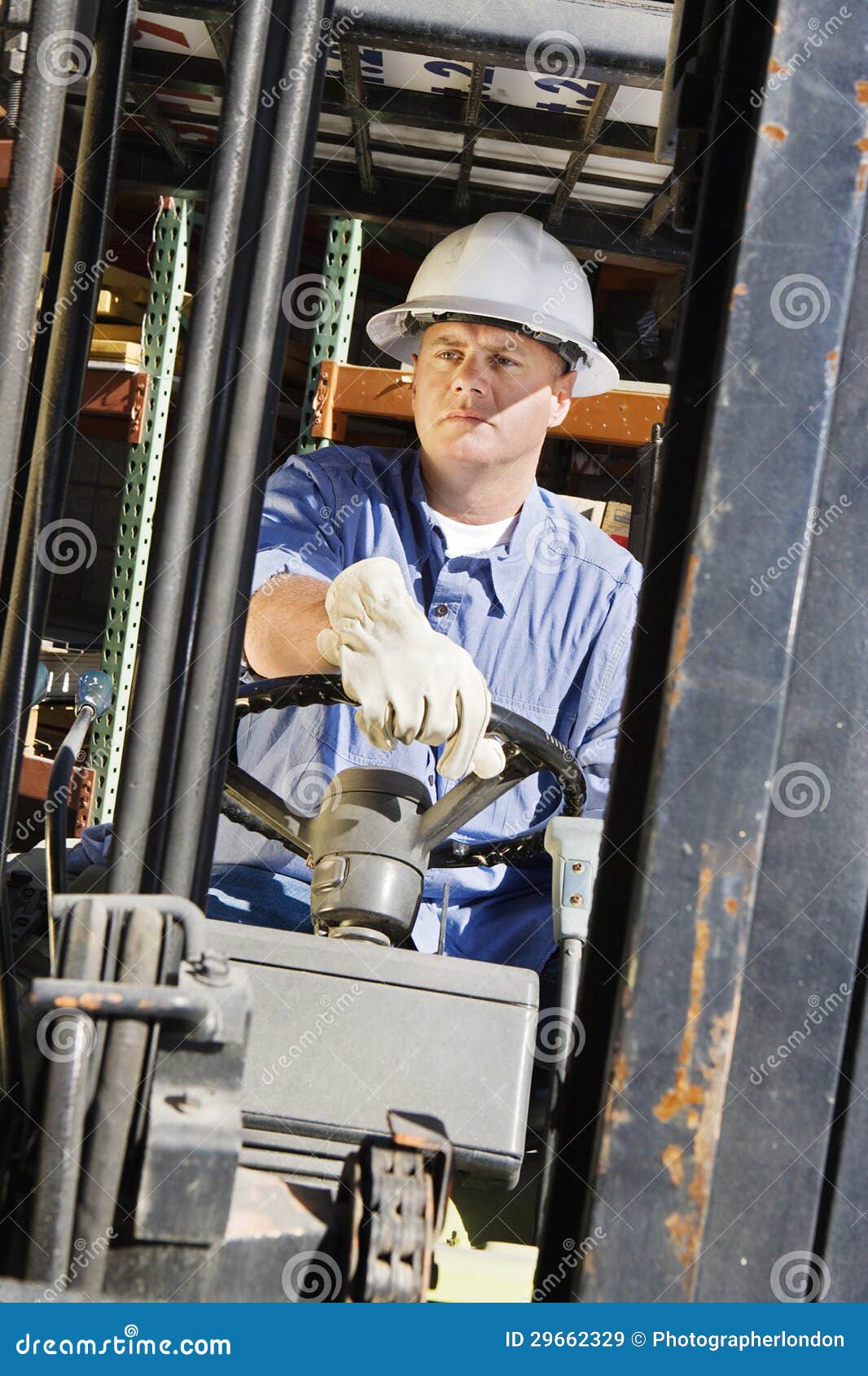 Man Driving a Forklift stock image. Image of protection - 29662329