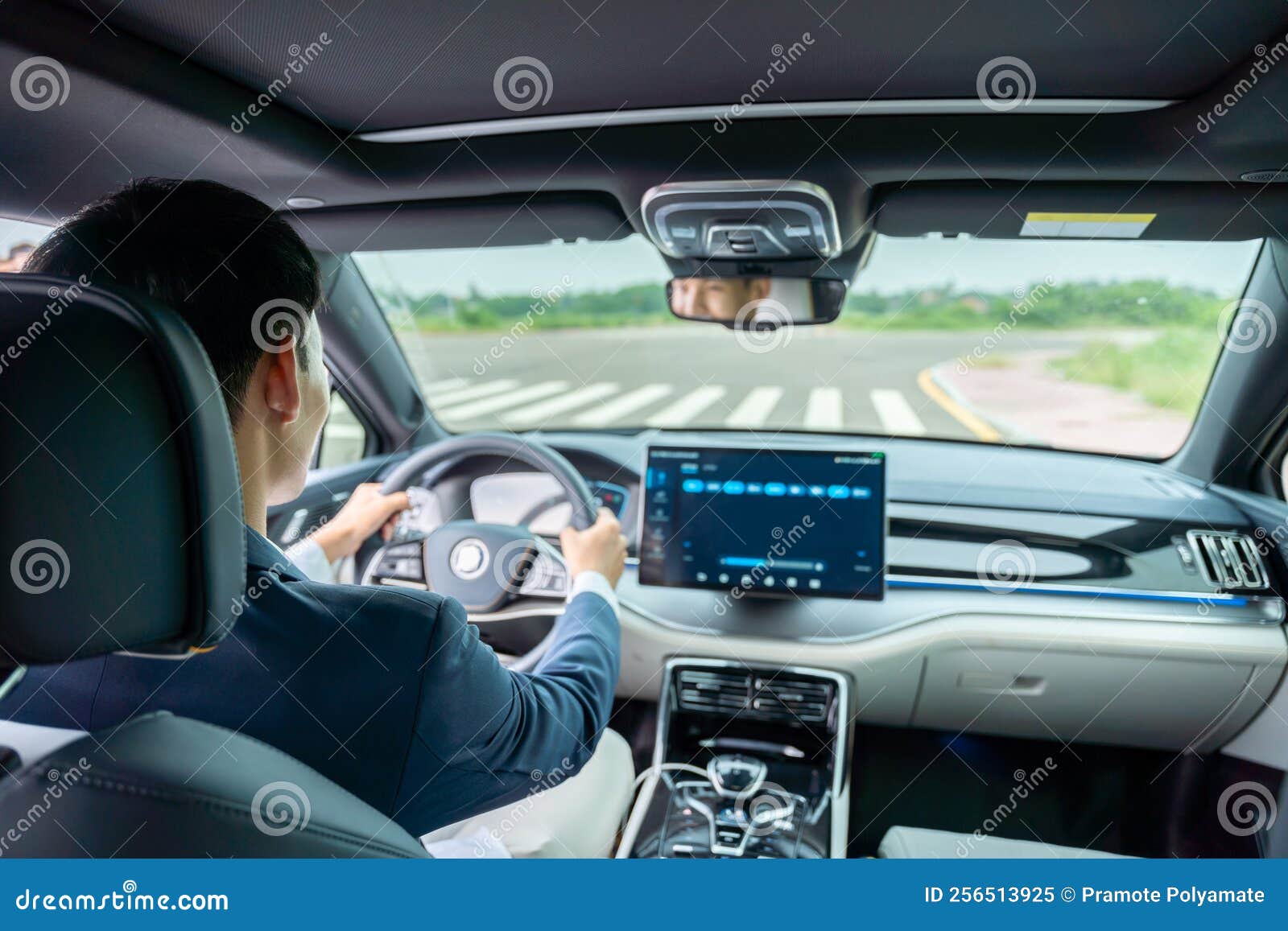 A Man Driving Inside of Electric Car Front View of the Road. Electric ...