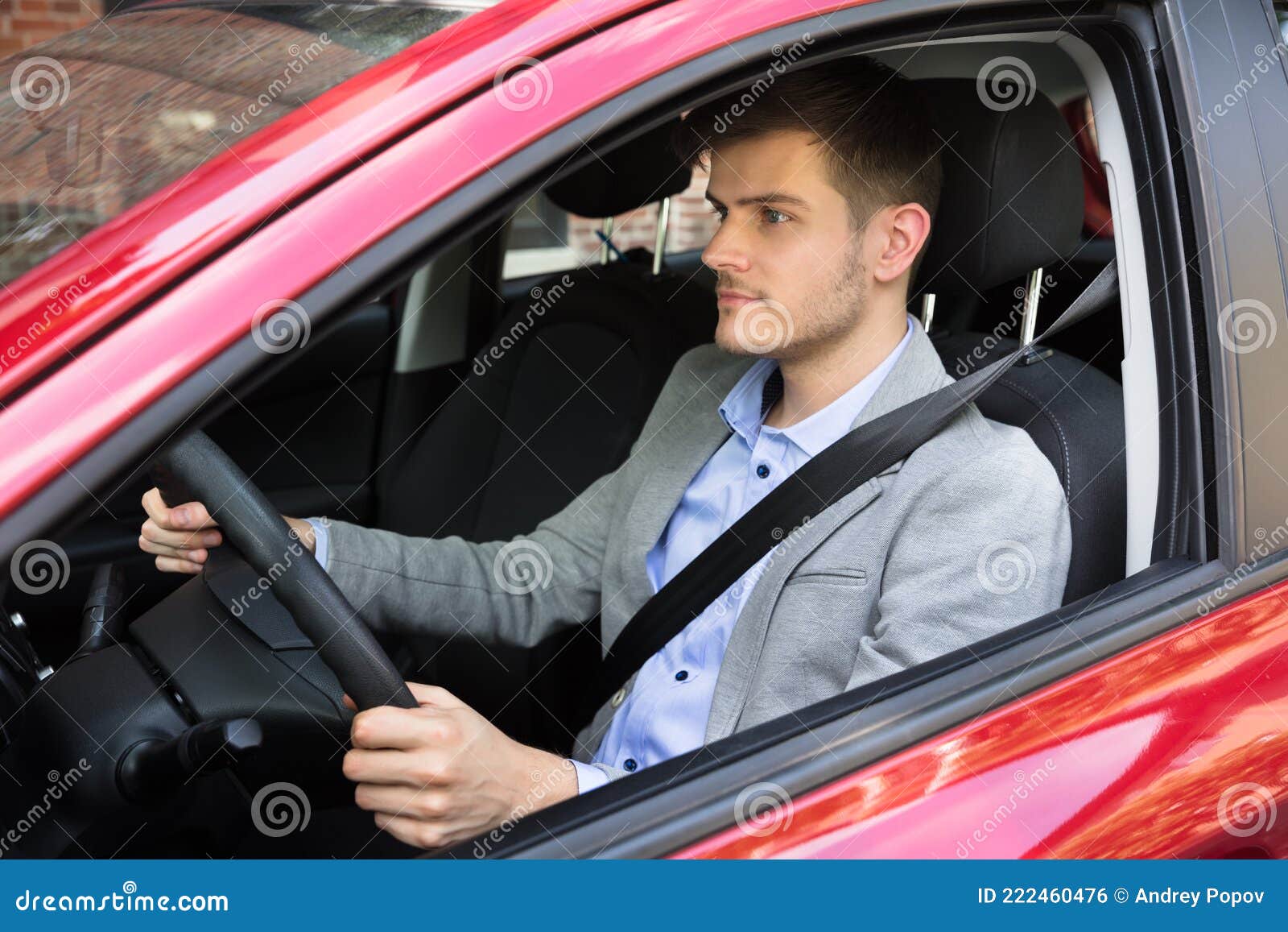 Man Driving Red Car stock photo. Image of closeup, outside - 222460476