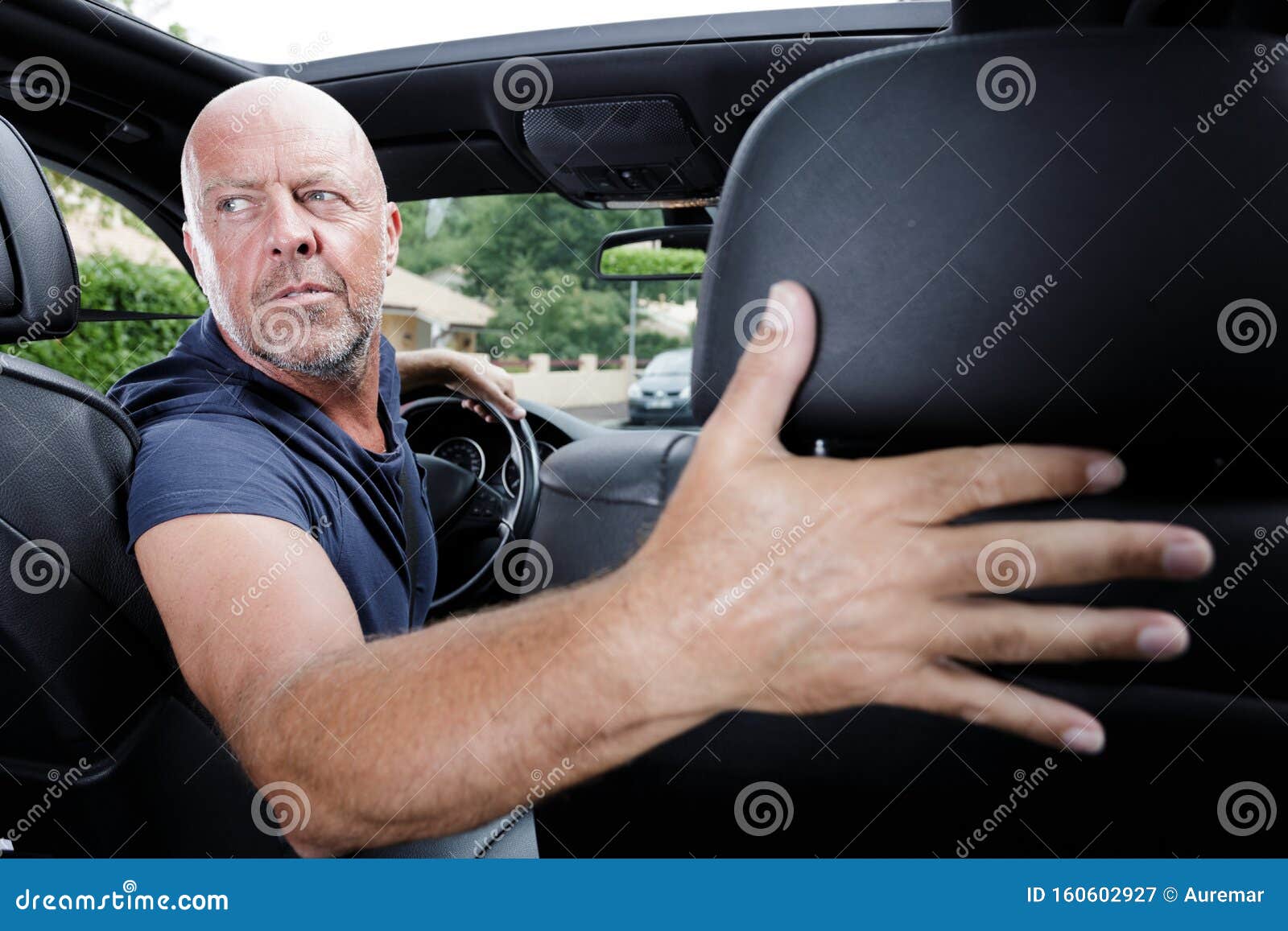 Man driving in reverse stock image. Image of inside - 160602927