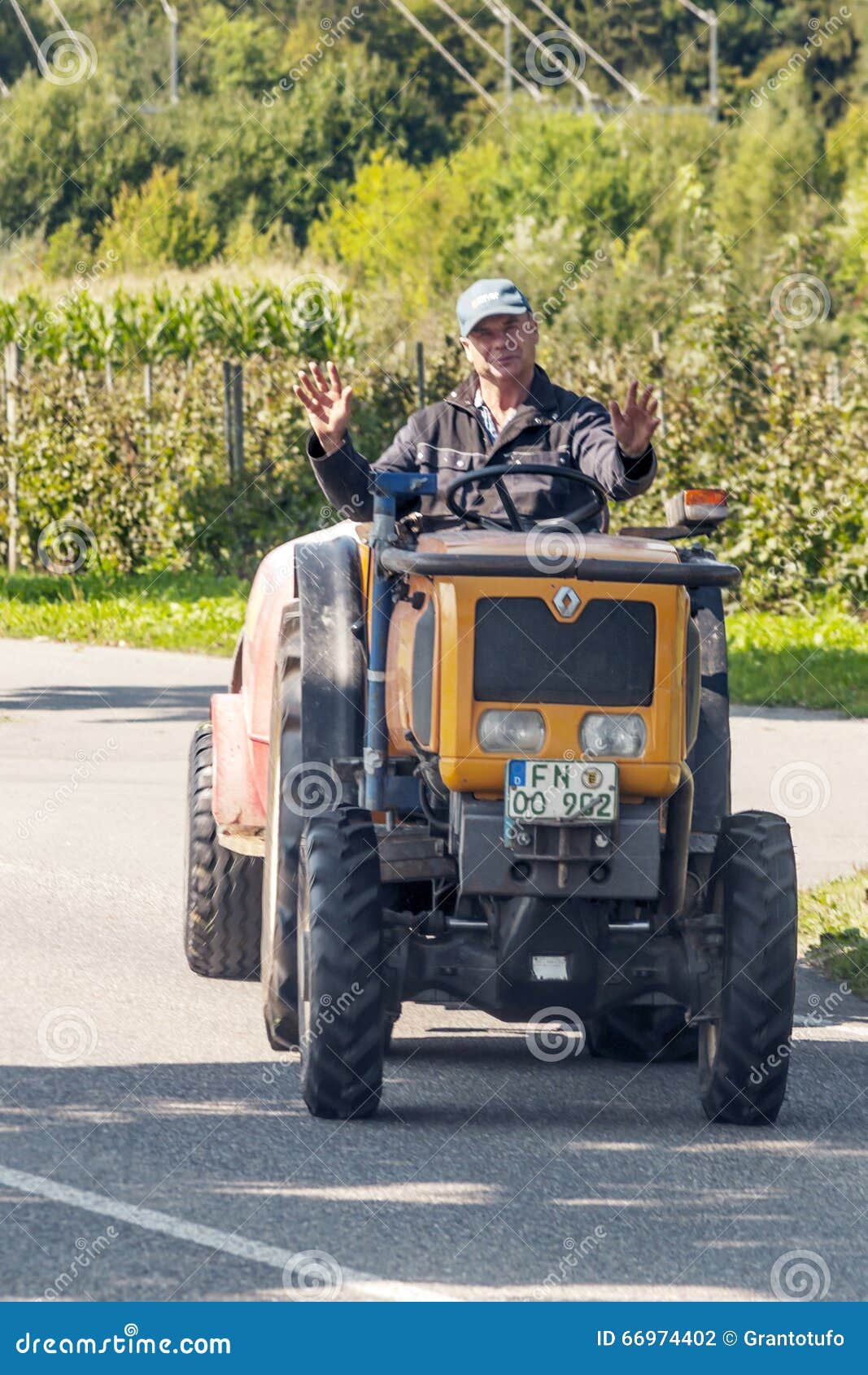 Man driving tractor editorial photography. Image of pretty - 66974402