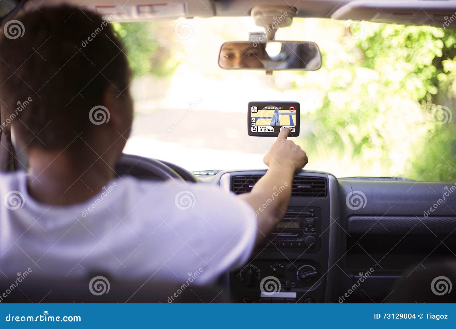 Man driving and using GPS stock photo. Image of young - 73129004