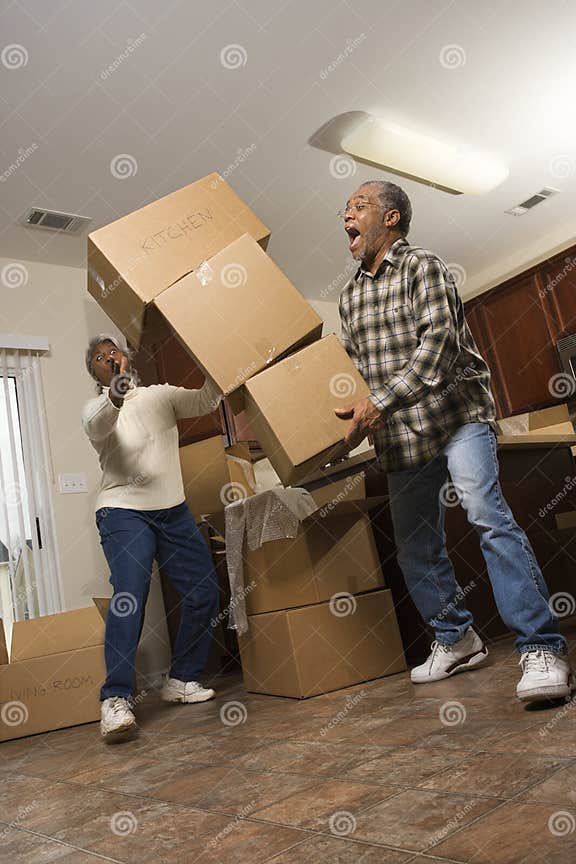 Man Dropping Stack of Boxes Stock Photo - Image of buying, fifties ...