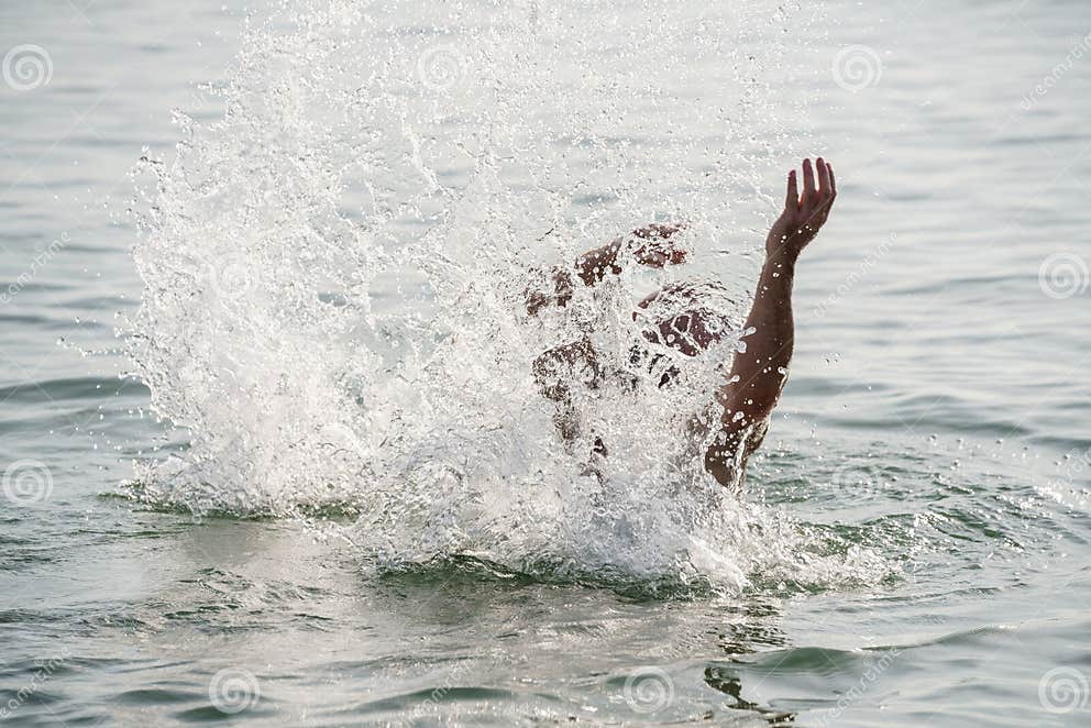 Man drowning in the ocean stock photo. Image of danger - 279606304