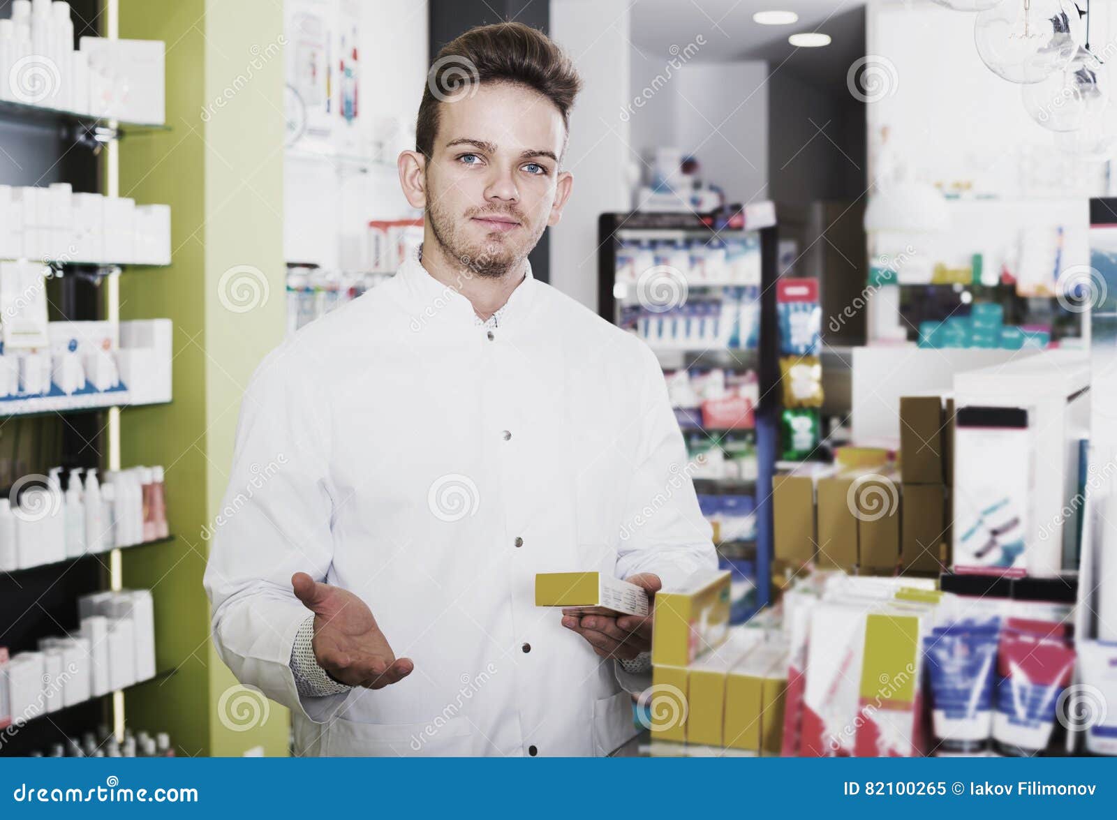 Man druggist in pharmacy stock image. Image of drugstore - 82100265