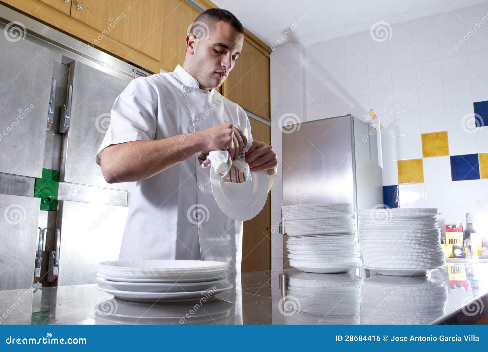 Man drying dishes stock photo. Image of working, young - 28684416