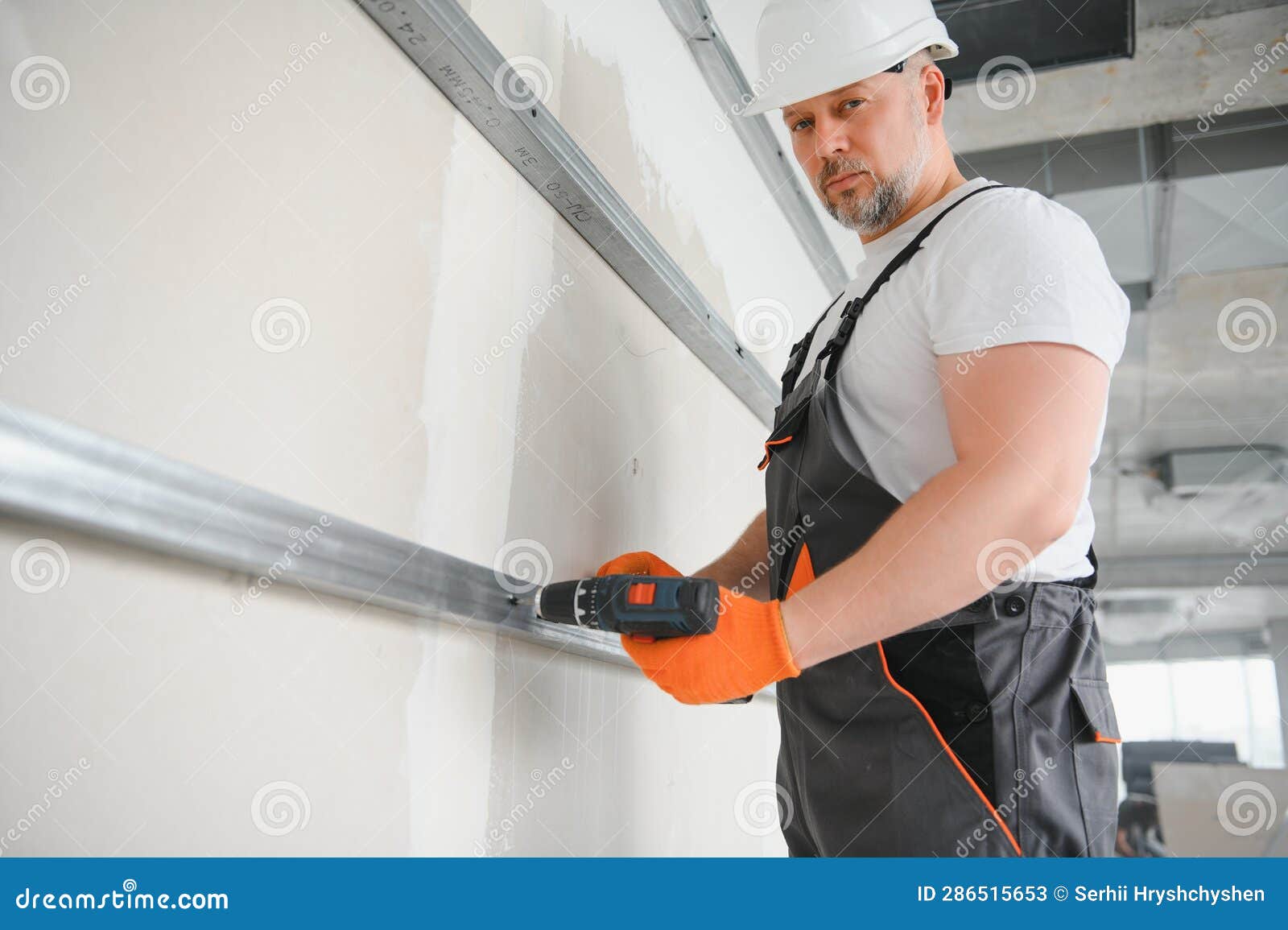 Man Drywall Worker Installing Plasterboard Sheet To Wall Stock Image ...