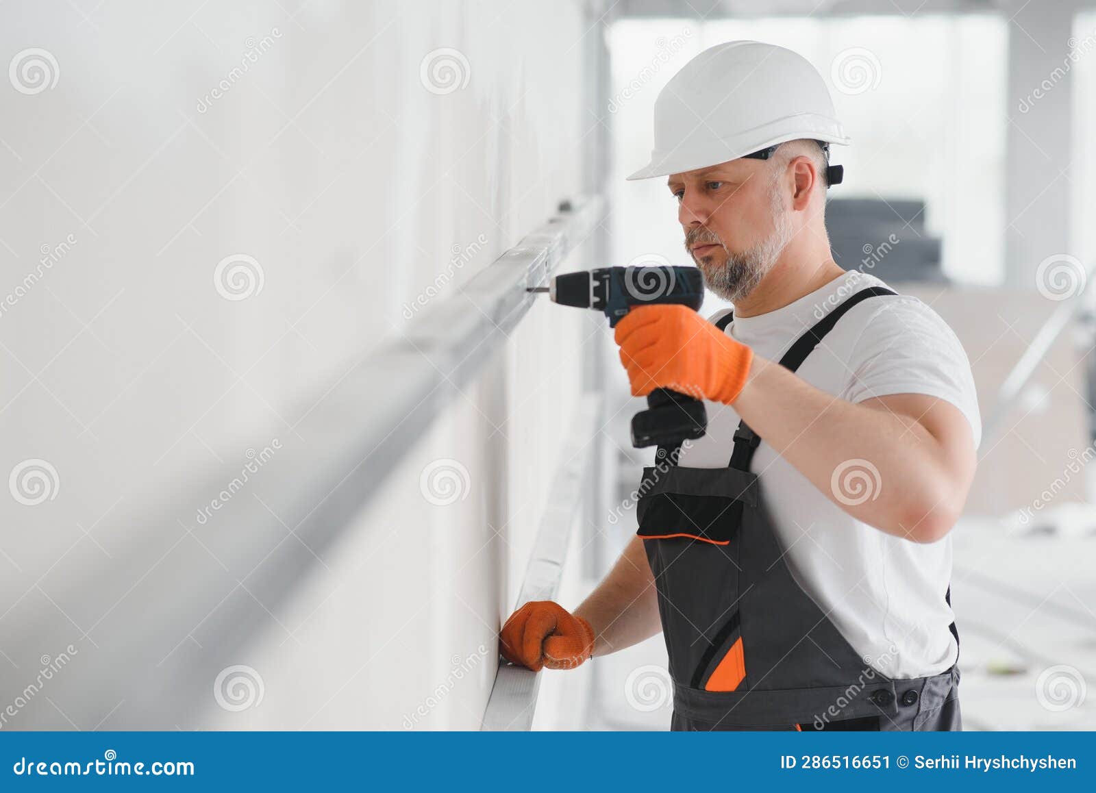 Man Drywall Worker Installing Plasterboard Sheet To Wall Stock Image ...