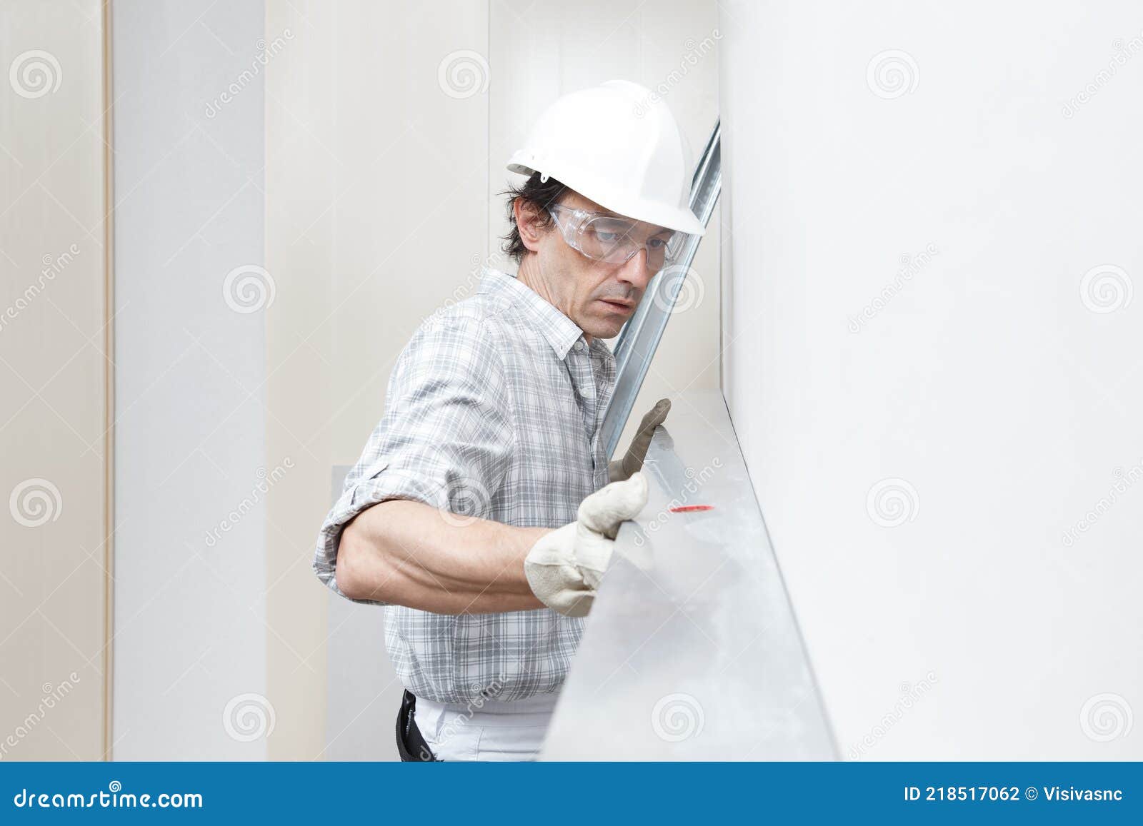 Man Drywall Worker or Plasterer Checking Level of White Plasterboard ...