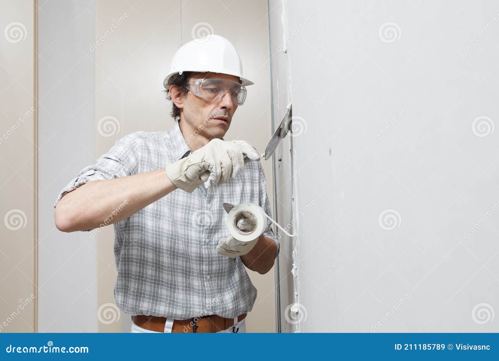 Man Drywall Worker or Plasterer Putting Mesh Tape for Plasterboard on a ...