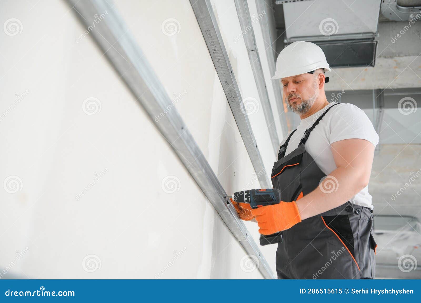 Man Drywall Worker or Plasterer Putting Mesh Tape for Plasterboard on a ...