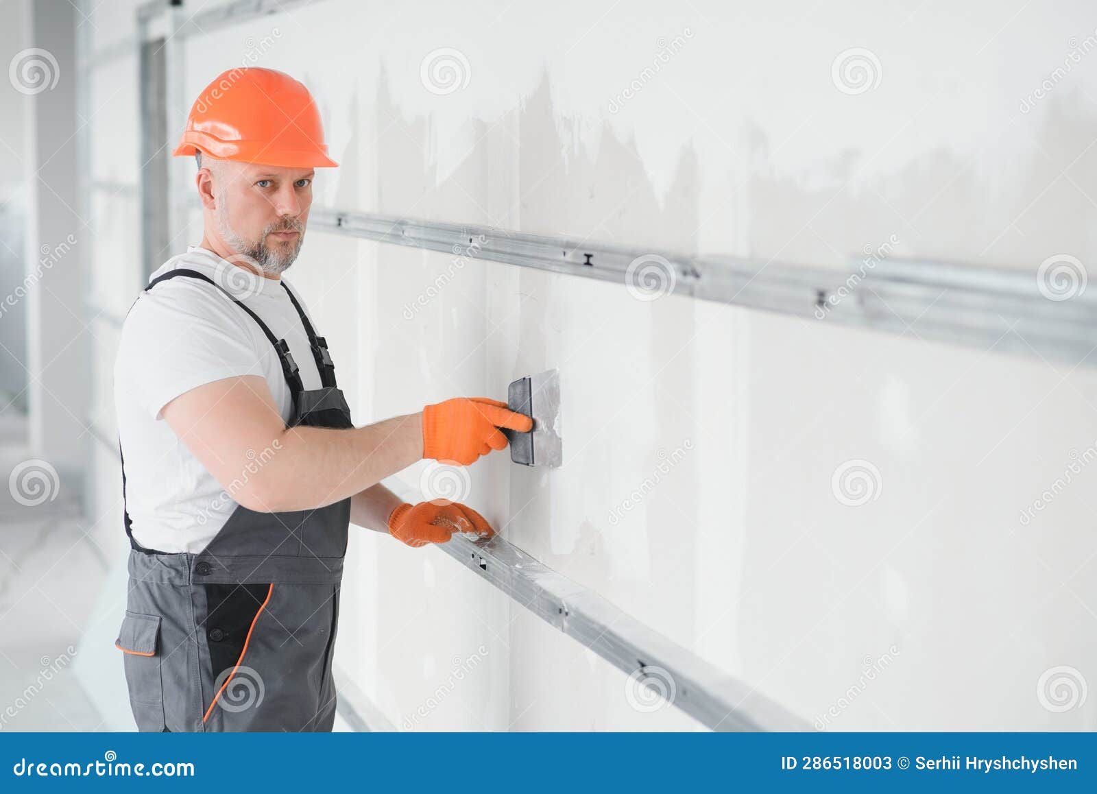 Man Drywall Worker or Plasterer Putting Mesh Tape for Plasterboard on a ...