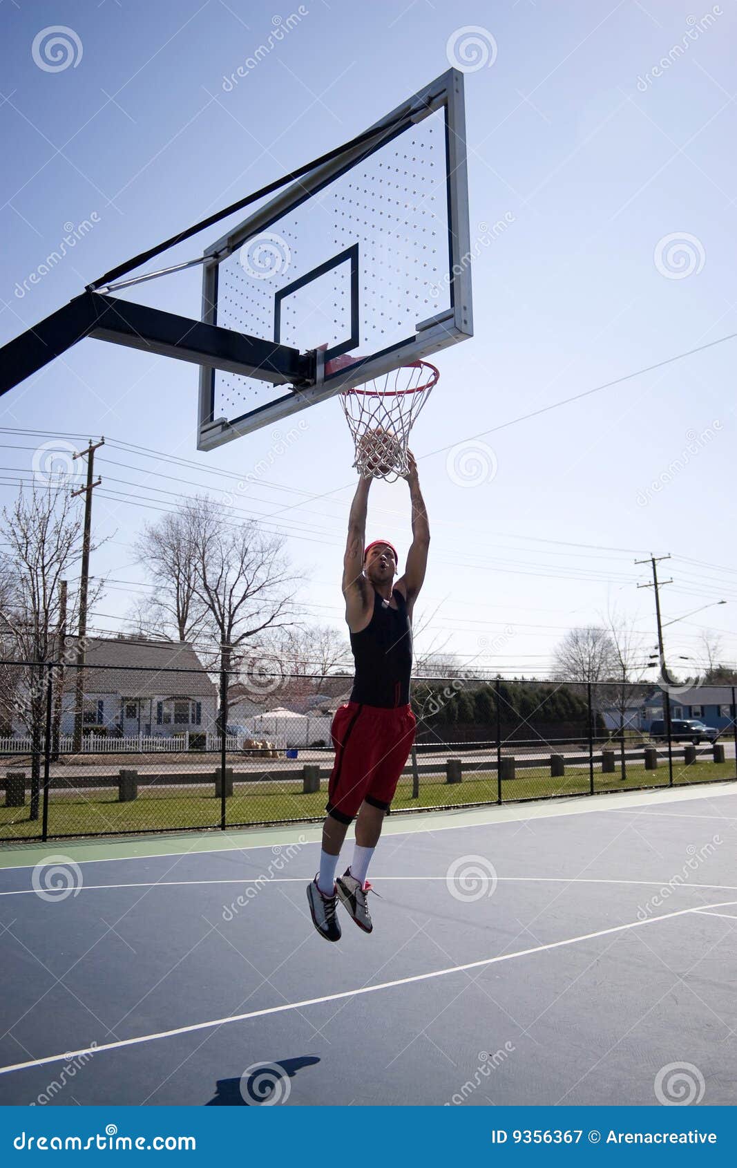 Man Dunking a Basketball stock image. Image of player - 9356367