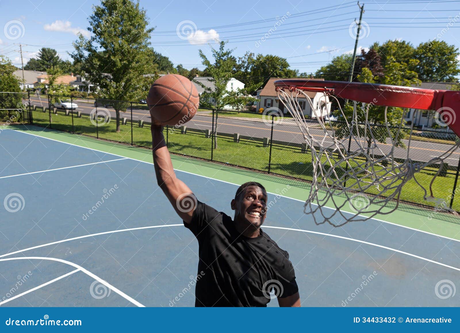 Man Dunking a Basketball stock photo. Image of active - 34433432