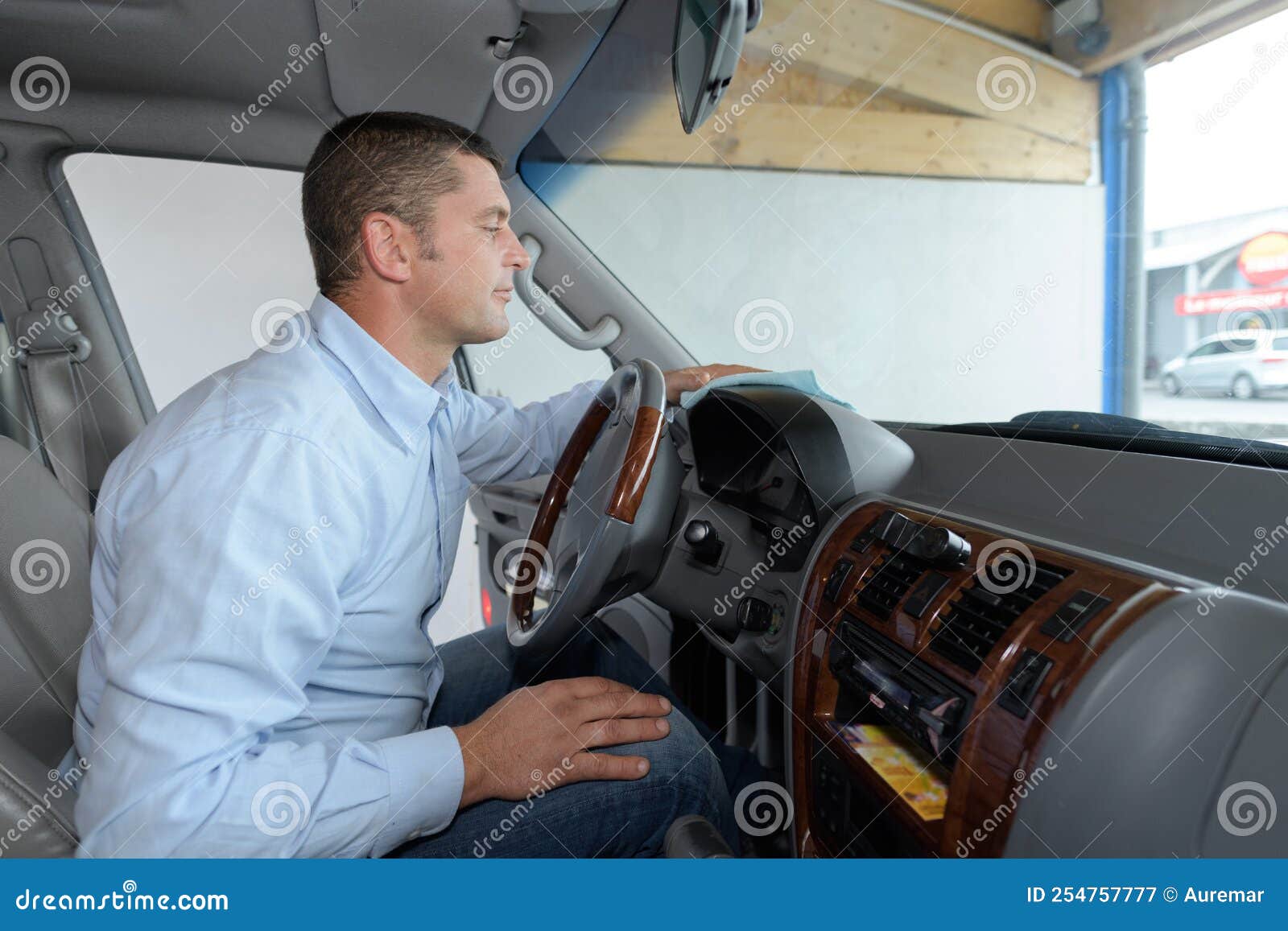 Man dusting vehicle cab stock image. Image of work, valeting - 254757777