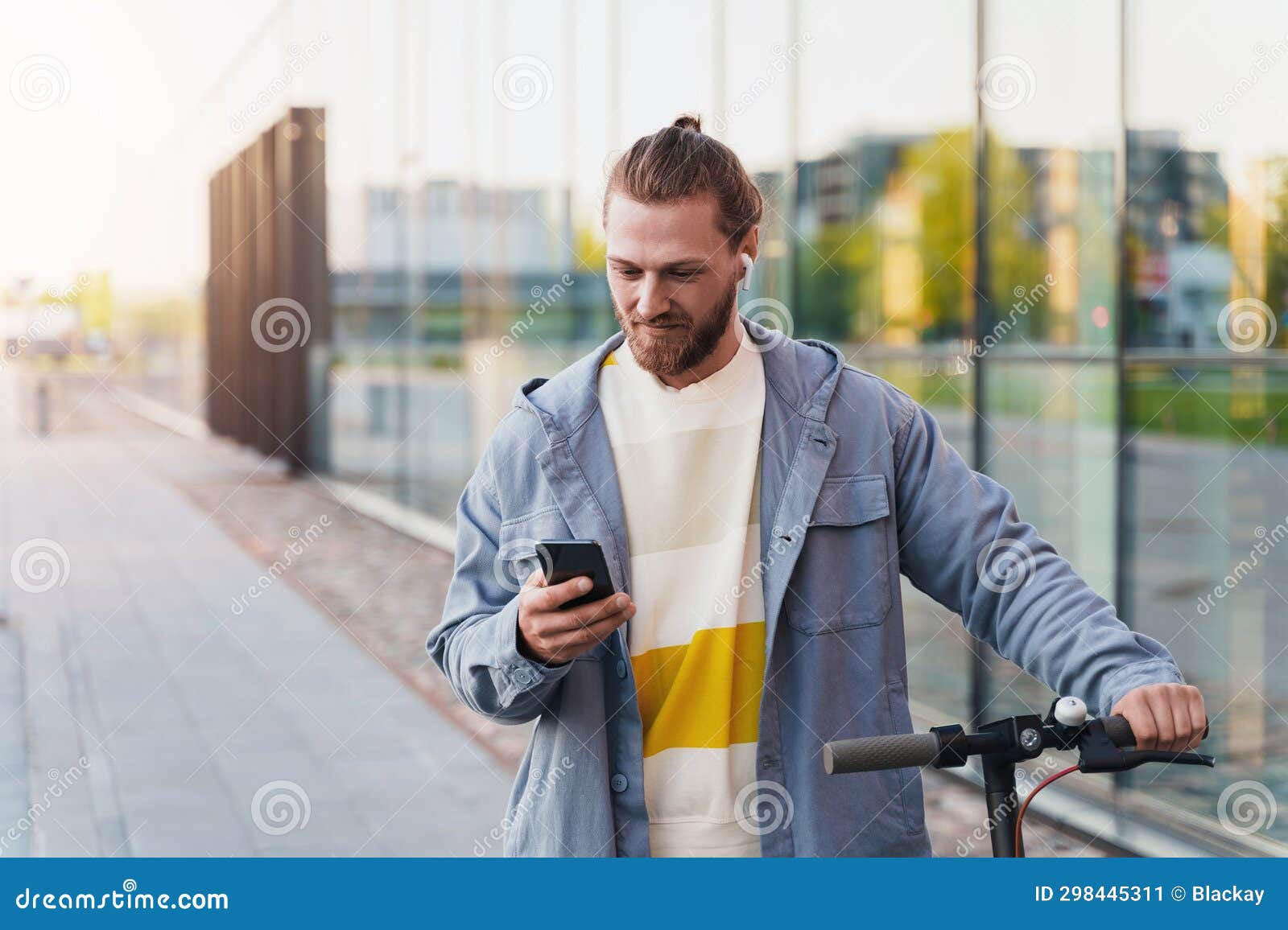 Man with E-scooter Using Scooter-sharing System Application on His ...