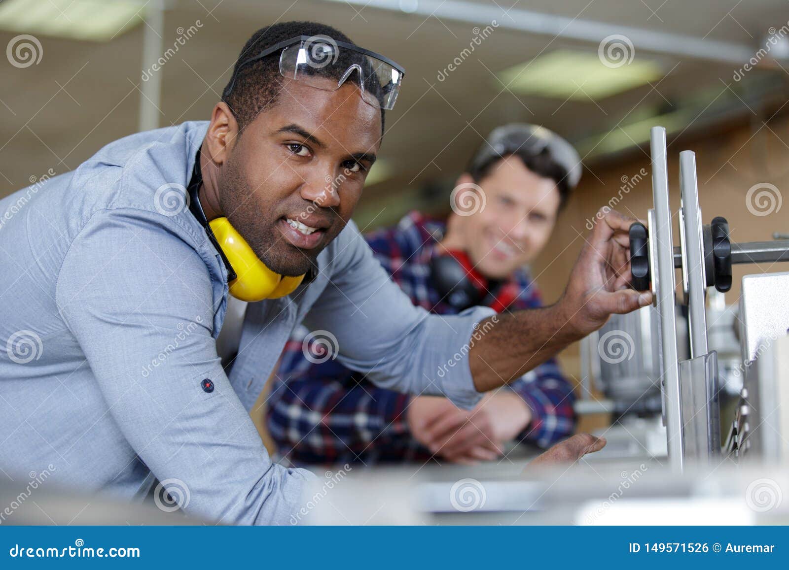 Man with Ear Protection Working in Factory Stock Photo - Image of ...