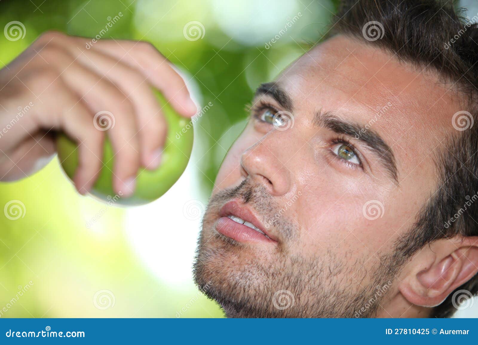 Man eating an apple stock image. Image of concentrated - 27810425