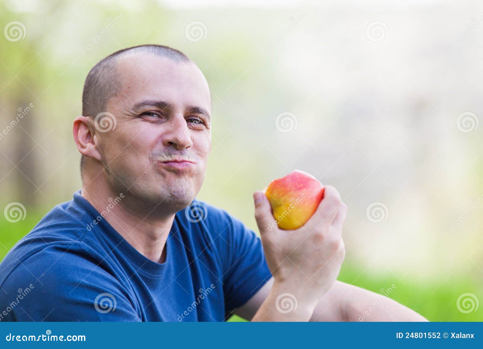Man Eating an Apple Outdoor Stock Photo - Image of hold, organic: 24801552