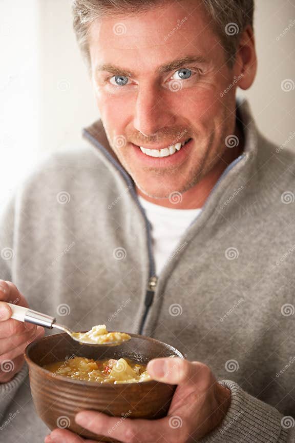 Man eating bowl of soup stock image. Image of lifestyle - 21410331