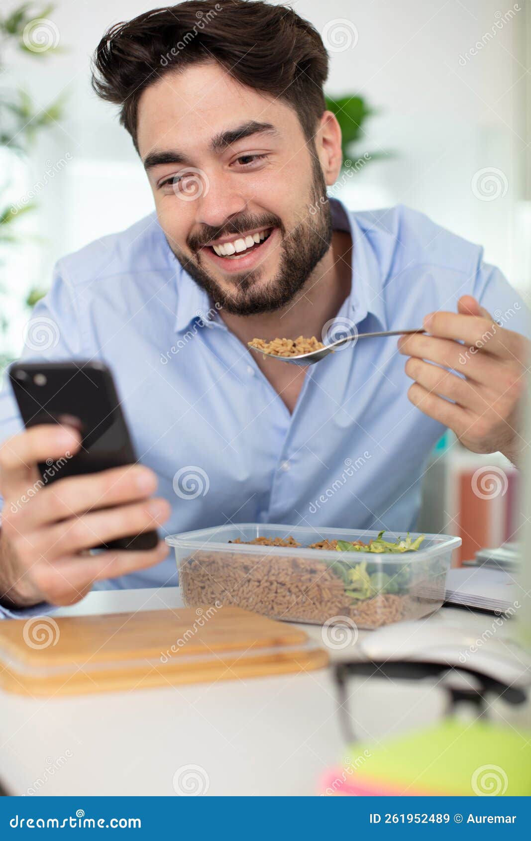 Man Eating Breakfast Whilst Checking Mobile Phone Stock Image - Image ...
