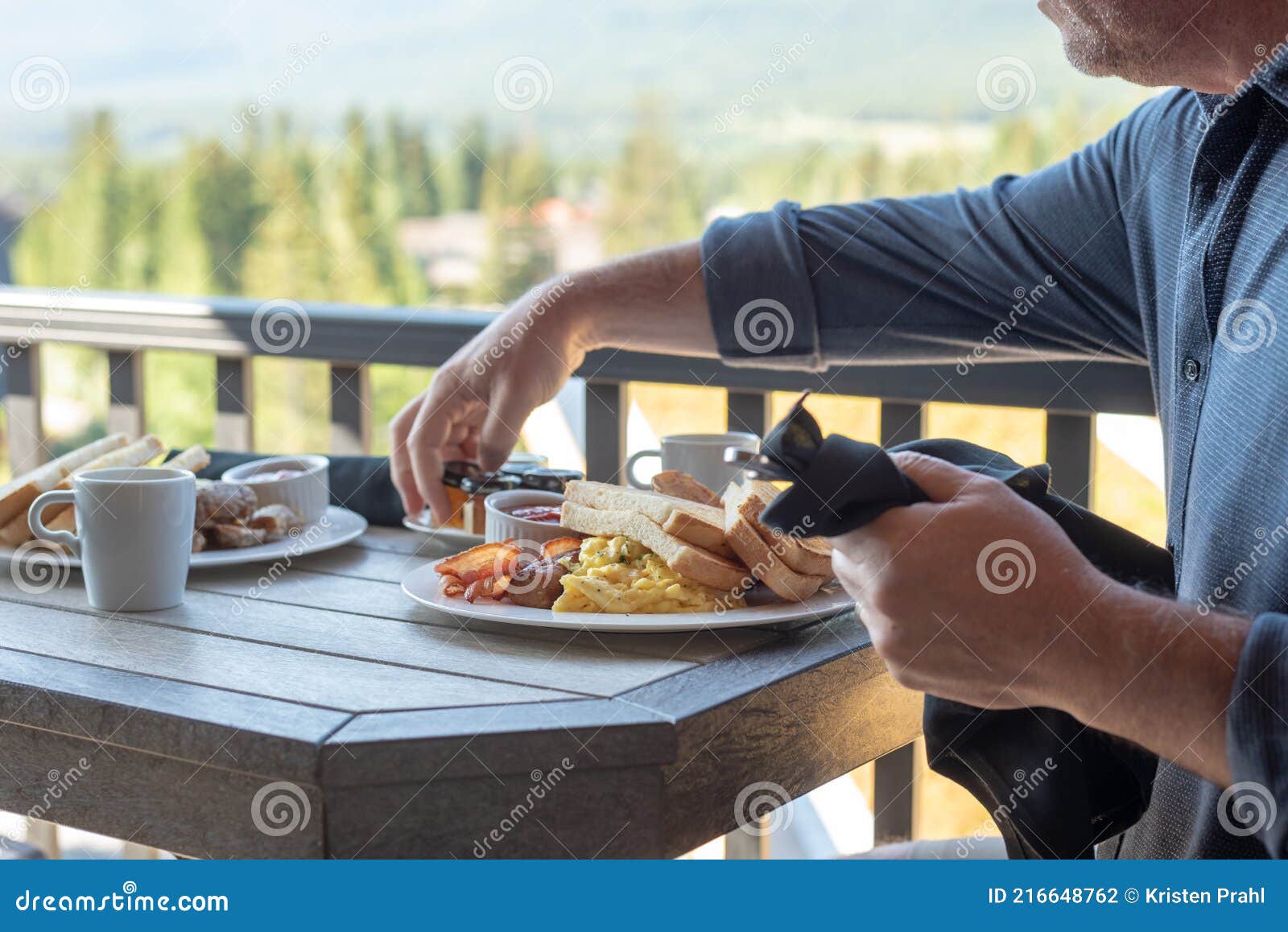Man Eating Brunch on a Balcony Stock Photo - Image of service, outdoor ...
