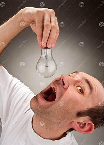 Man eating bulb stock image. Image of creativity, electricity - 18870113