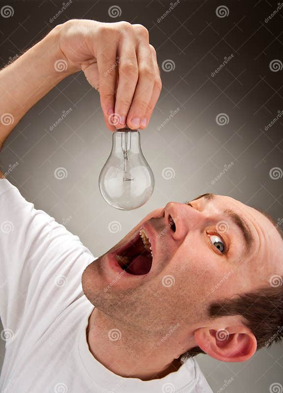 Man eating bulb stock image. Image of creativity, electricity - 18870113