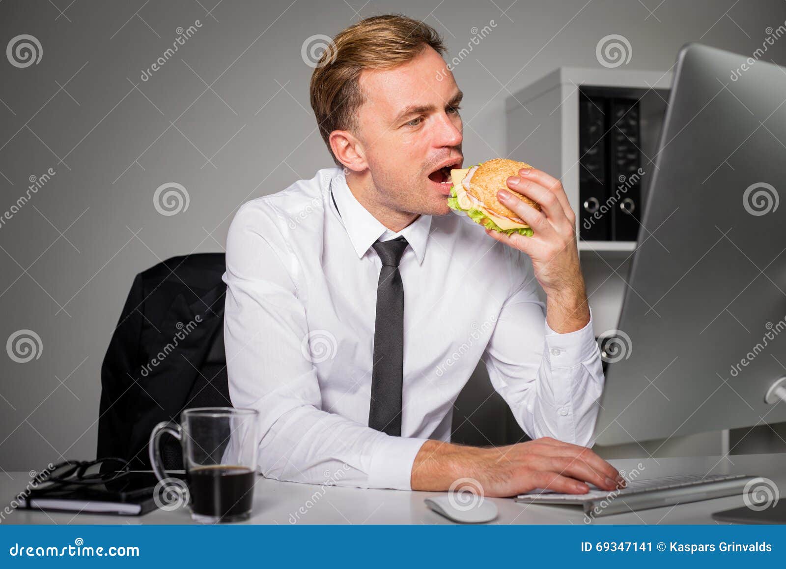Man Eating Burger and Working Stock Image - Image of burger, computer ...