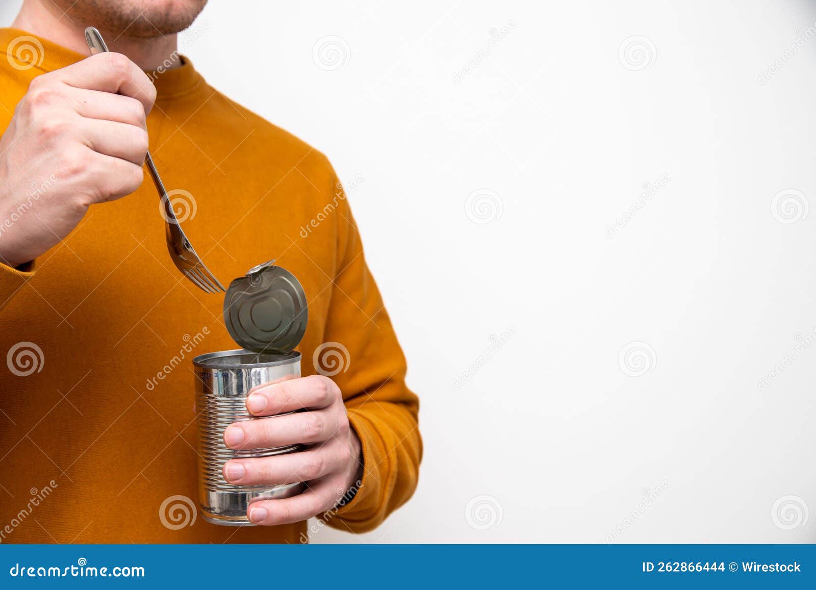 Man eating a can goods stock photo. Image of smile, healthy - 262866444