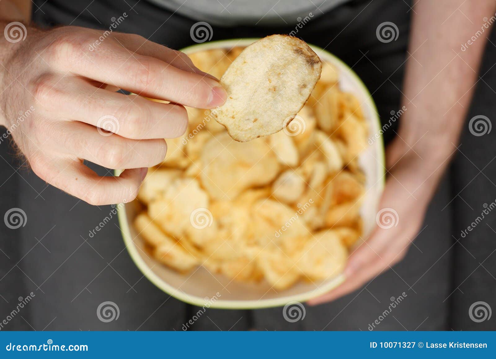 Man eating chips stock image. Image of fast, bored, male - 10071327