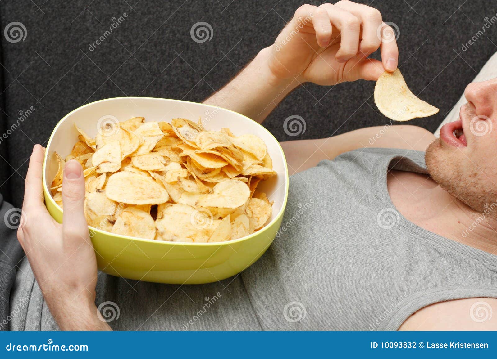 Man eating chips stock photo. Image of fries, snacks - 10093832