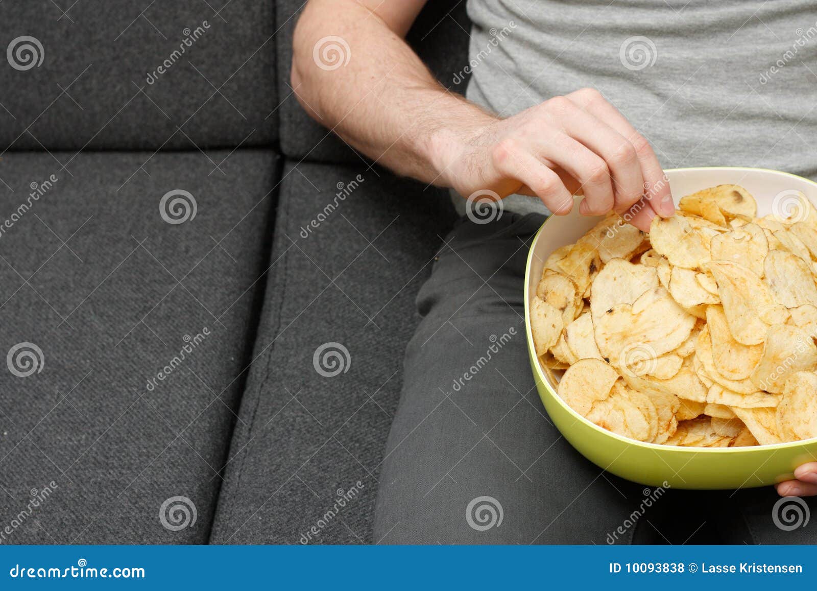 Man eating chips stock photo. Image of drink, male, movie - 10093838