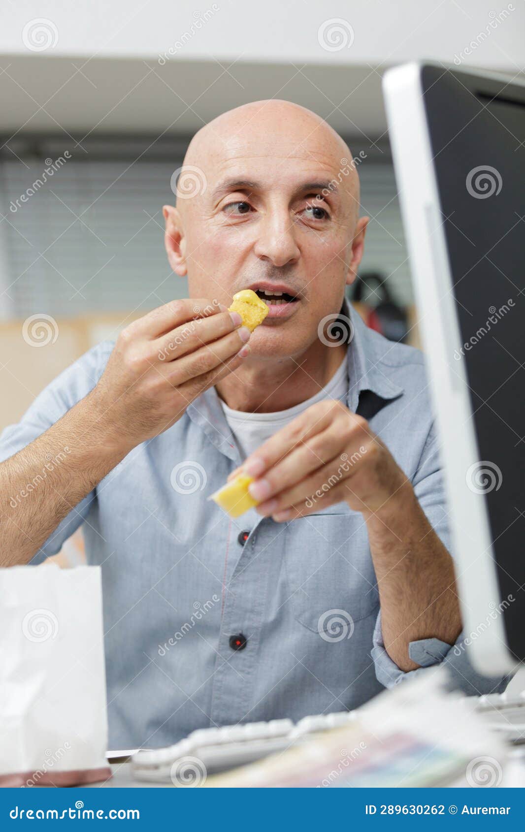 Man Eating Chips in Front Computer Stock Photo - Image of eating ...
