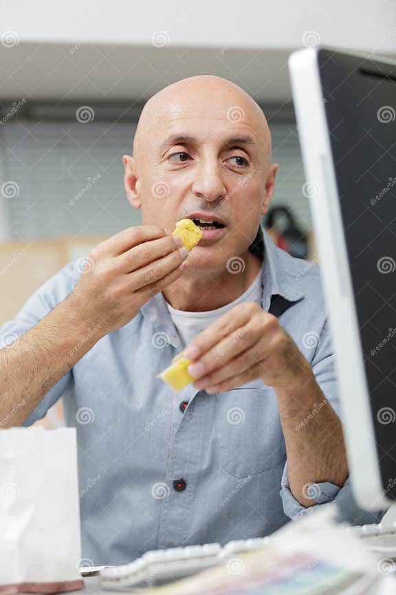Man Eating Chips in Front Computer Stock Photo - Image of eating ...